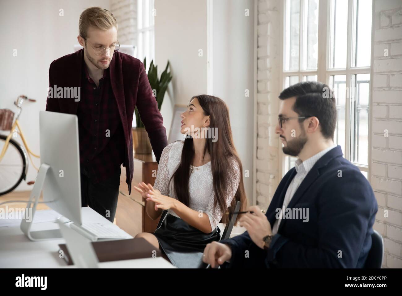 Diverse colleagues work together in coworking office Stock Photo - Alamy