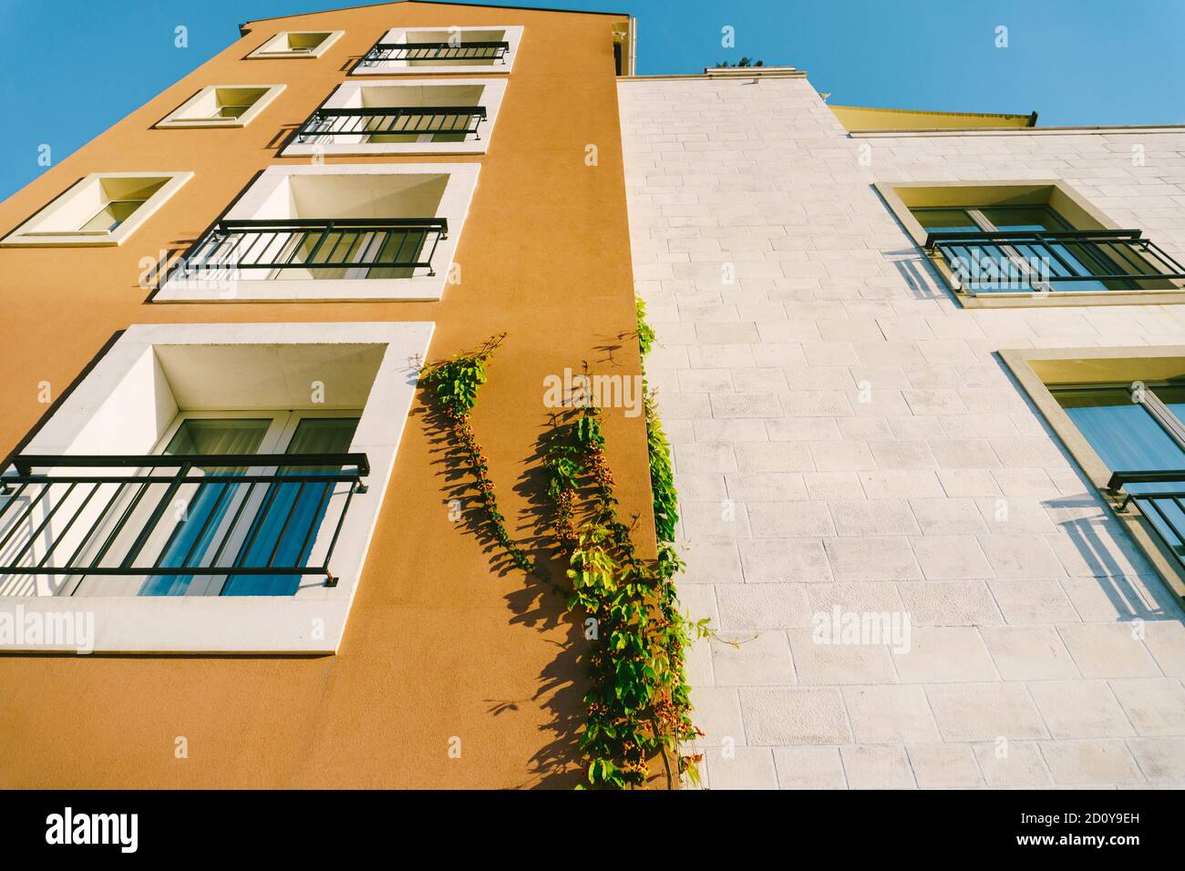 Close-up of a high-rise building with metal barriers and a winding ...