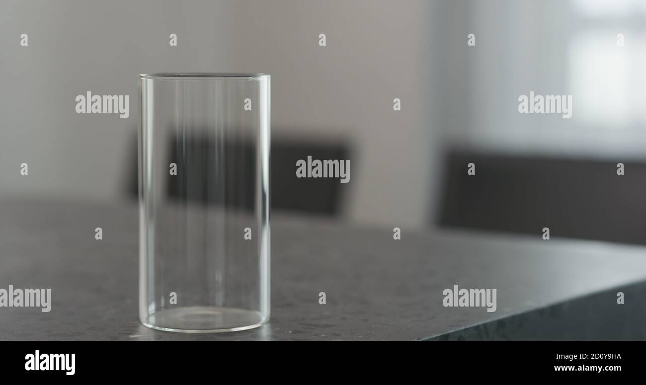 Empty highball glass on concrete countertop on kitchen, wide photo ...