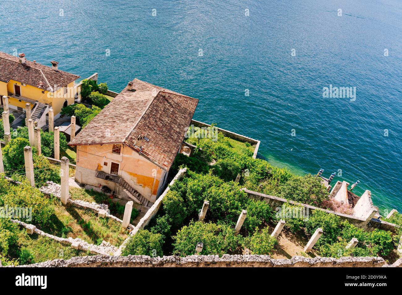 Lemon trees by the water, Limone, town on Garda Lake, Lombardy, Italy ...