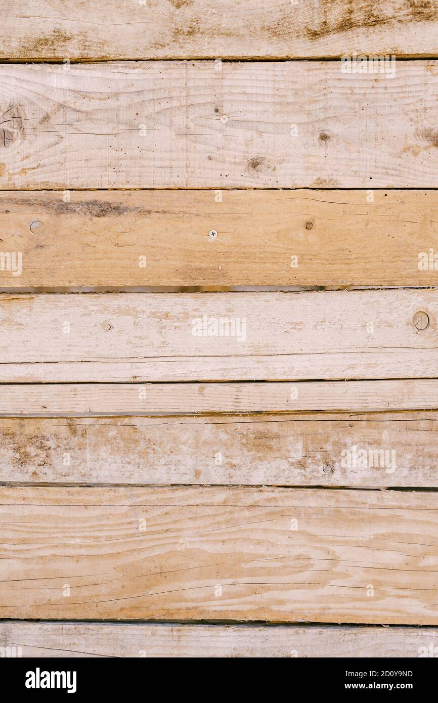 Light-colored fence boards knocked down in a horizontal position Stock ...