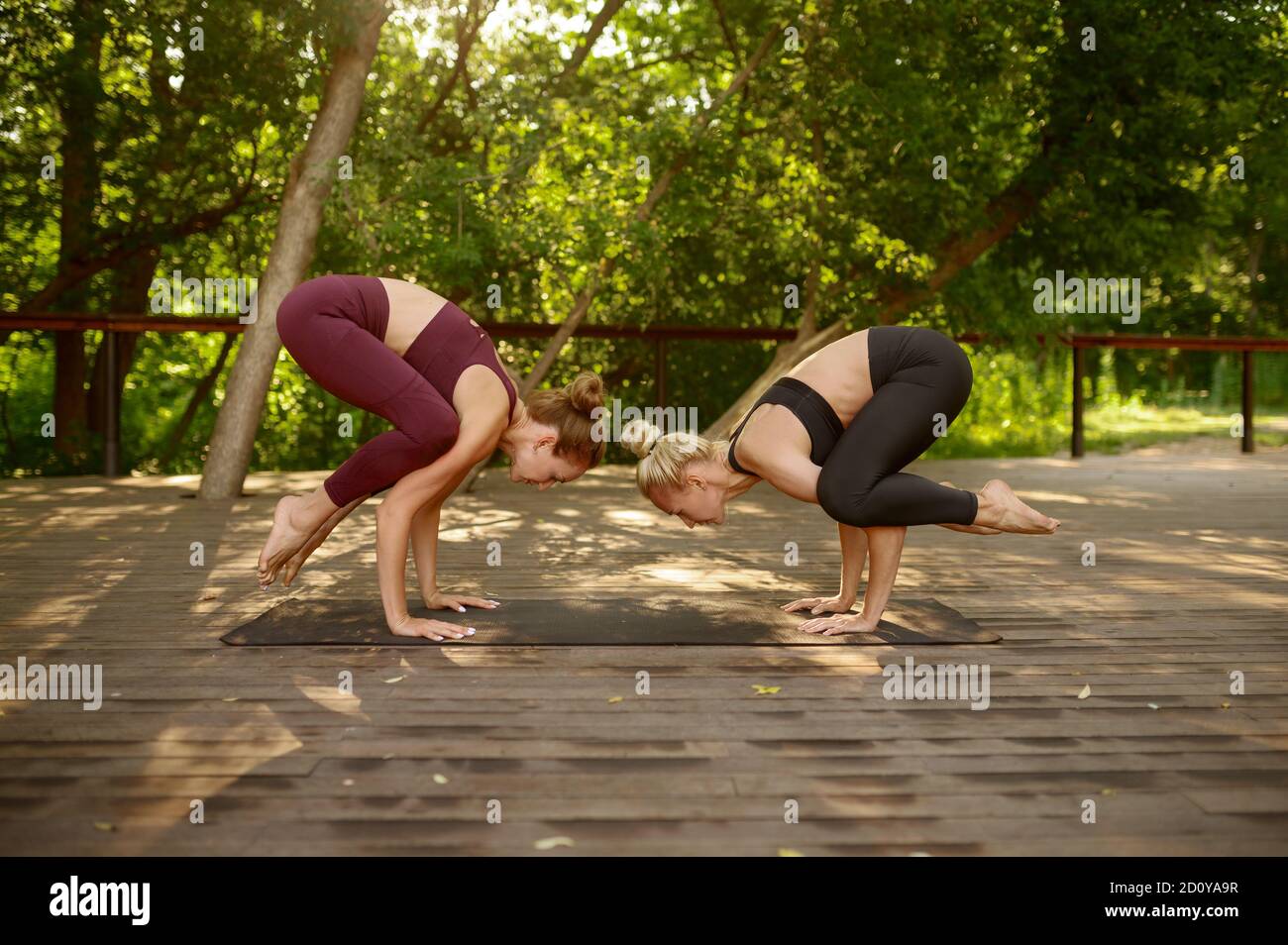 Women stands on hands, balance exercise, yoga Stock Photo - Alamy