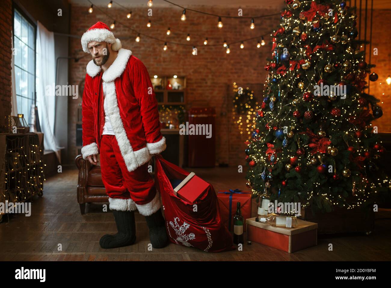 Bad drunk Santa claus brings gifts, nasty party Stock Photo - Alamy