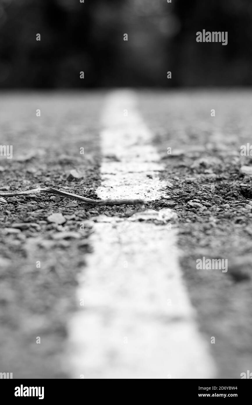 Close up and selective focus of starting white line of track in village ...