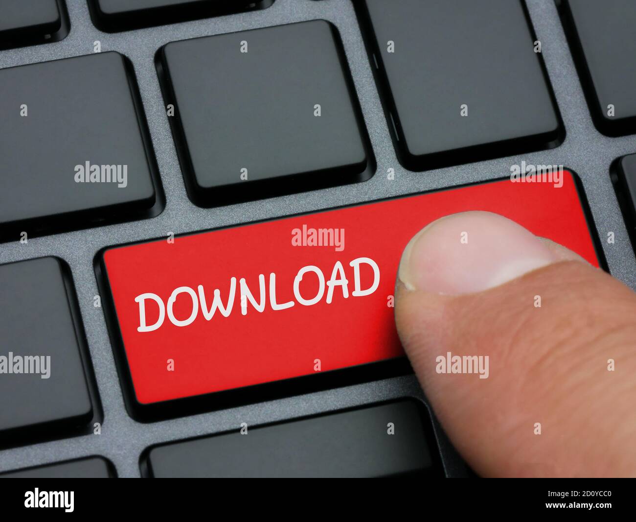Closeup finger typing on download key on computer keyboard Stock Photo ...