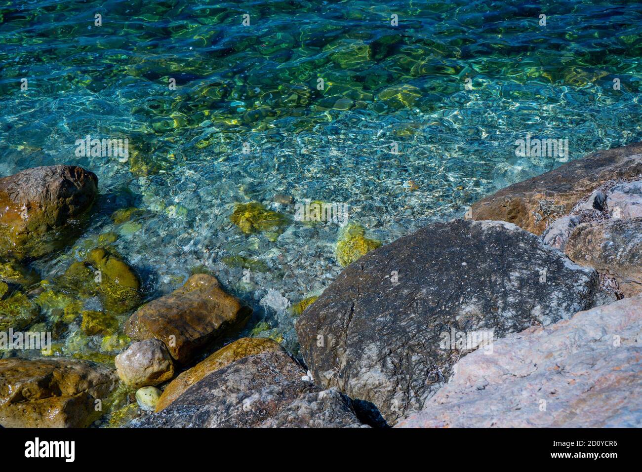 Green color Stones in the water. Abstract green closeup on transparent ...