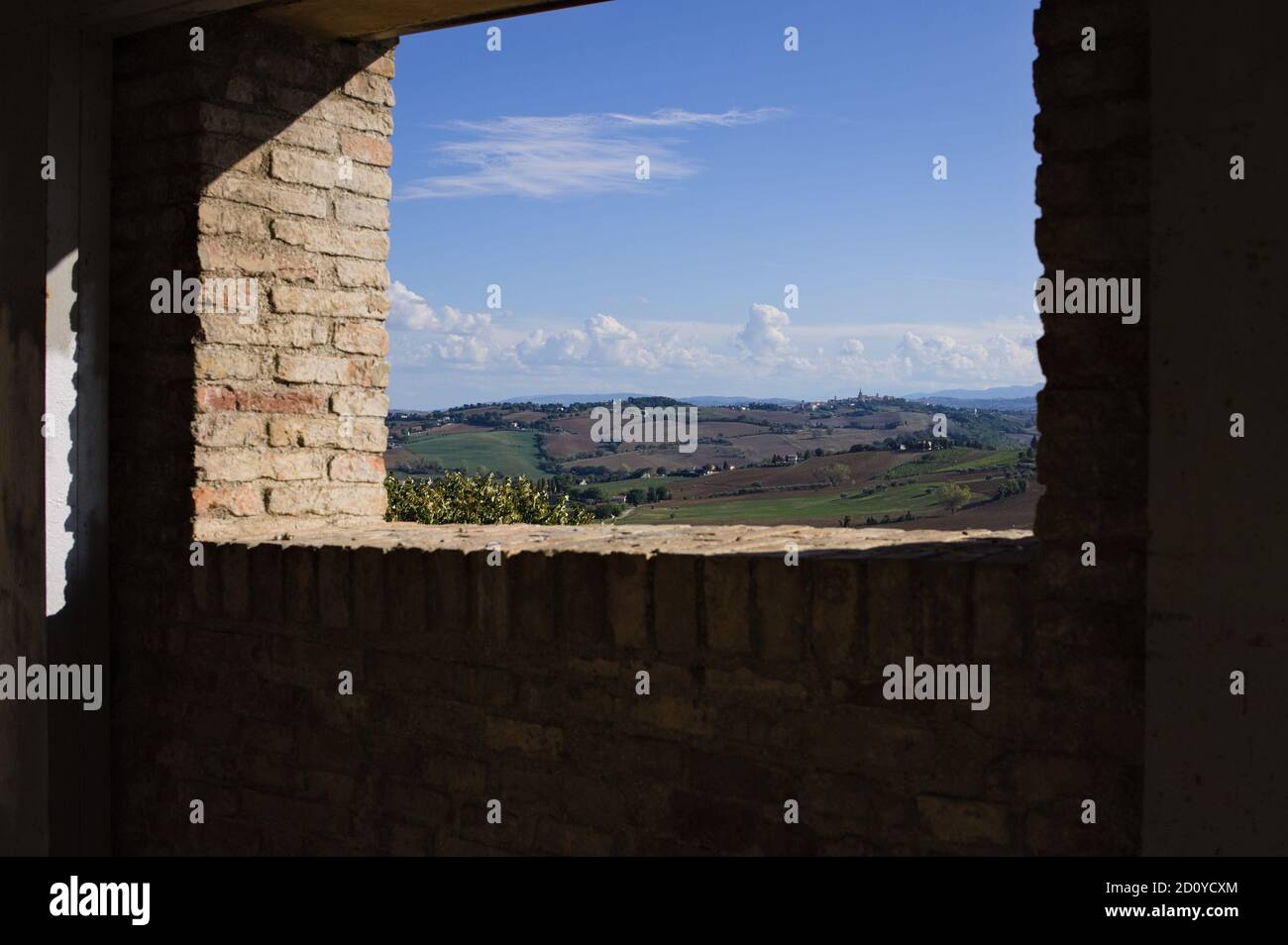 Beautiful landscape with italian hills seen through a medieval arch ...