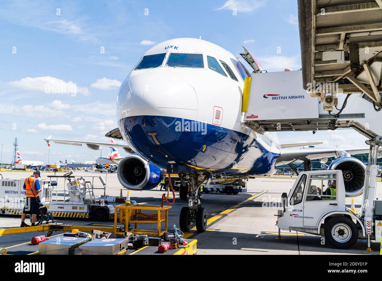 Ground view from front of aircraft of people boarding a British Airways ...