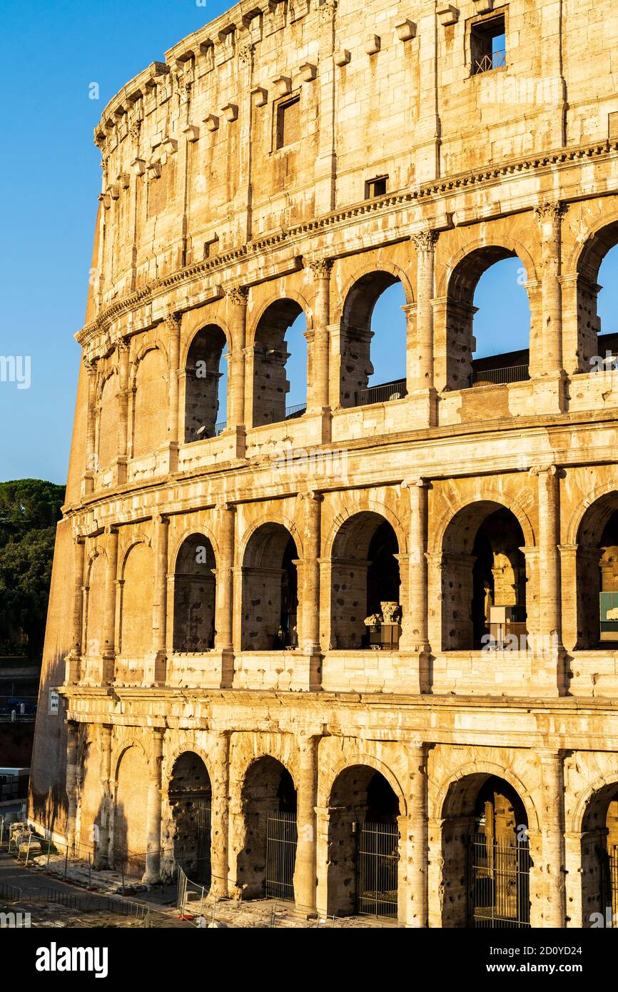 Section of the Roman Colosseum in the early morning light with the dawn ...