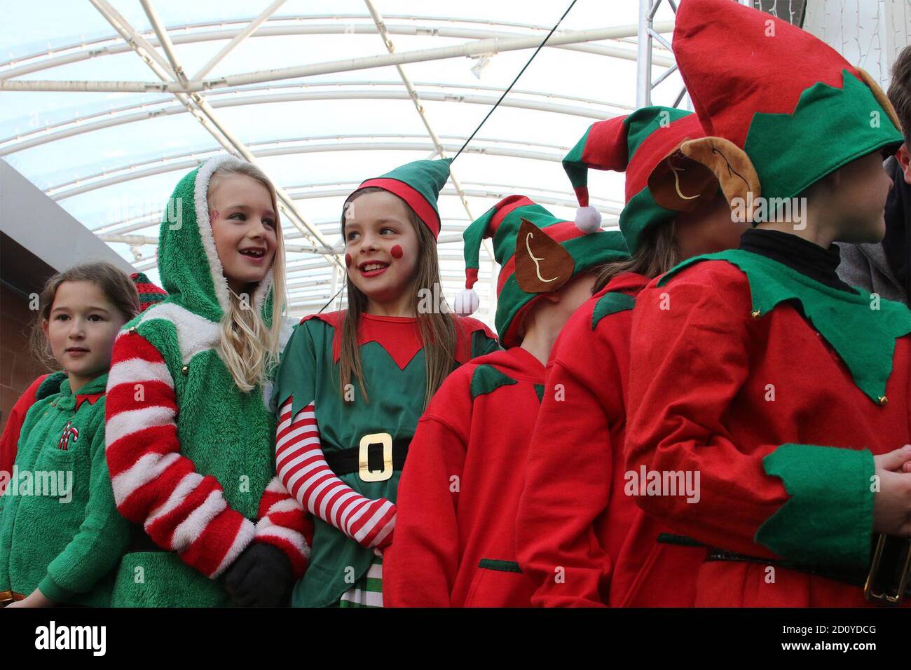 Children dressed as Elves queue up to Santa Stock Photo - Alamy