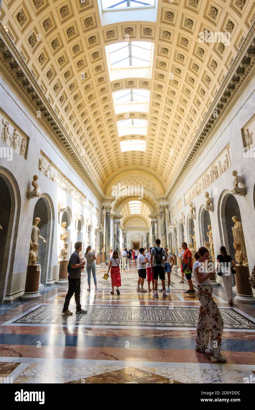 People at the Braccio Nuovo, new wing, of the Chiaramonti gallery with ...