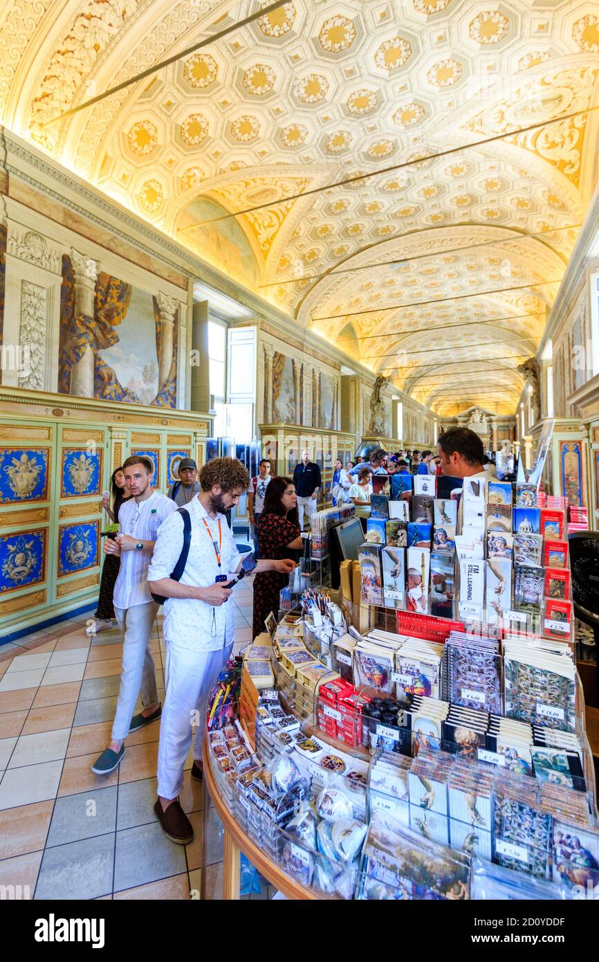 People looking at books, gifts and souvenirs at the small book shop ...