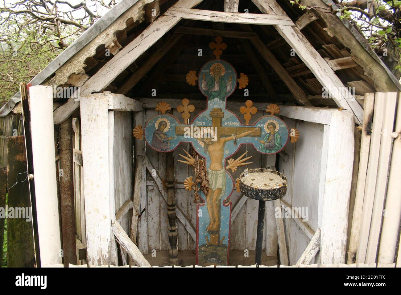 Roadside crucifix in Romania's countryside. Traditionally sculpted ...