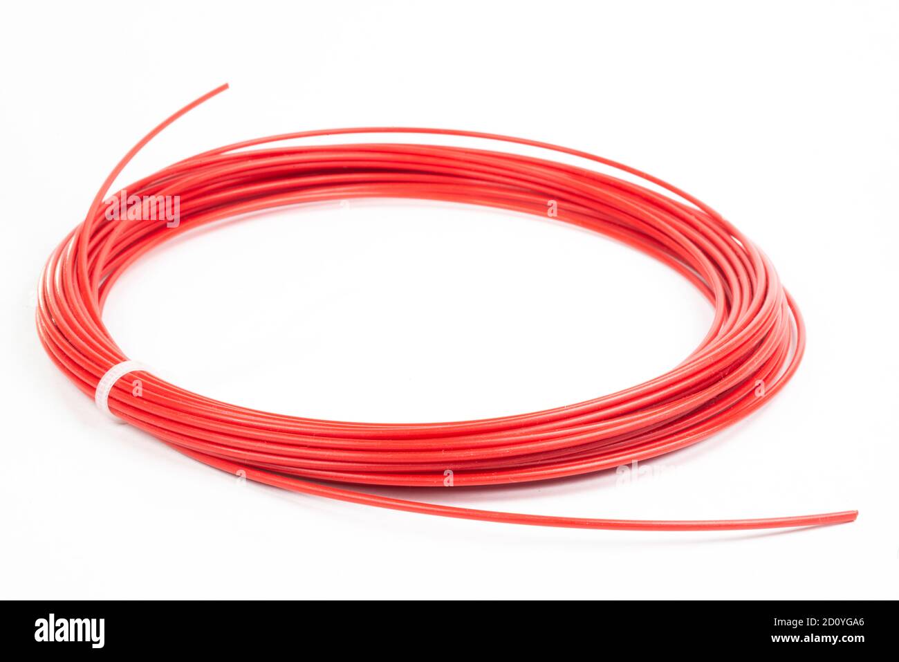 Top view of red rolled filament 3D pen PLA isolated on white. Closeup ...