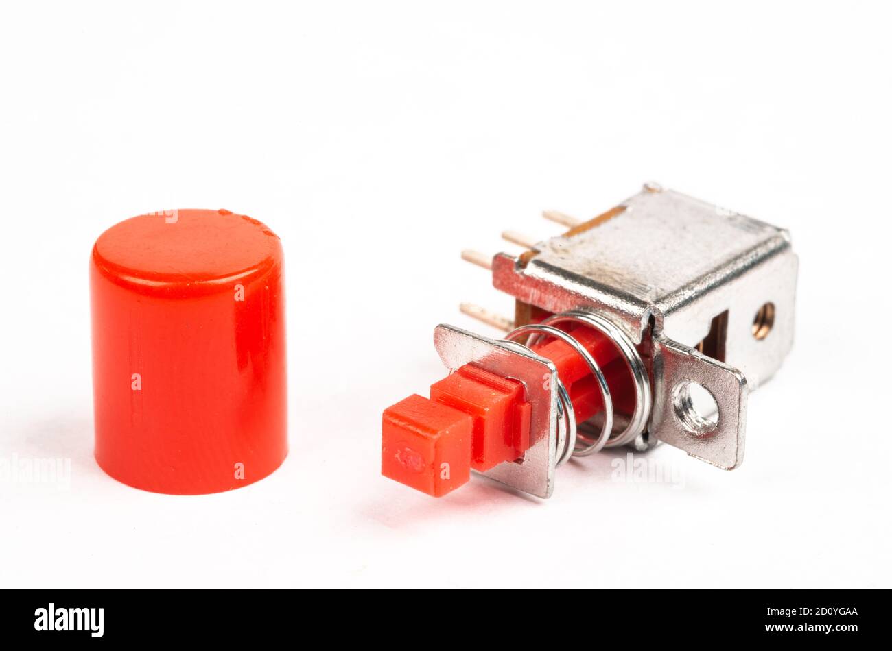 Miniature electric switches with red caps on isolated white background ...