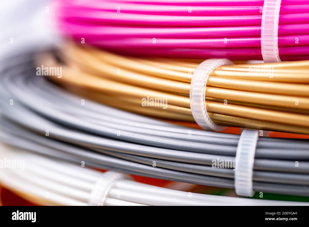 Bunch of colorful rolled cables. Closeup of plastic bright wires for 3D ...