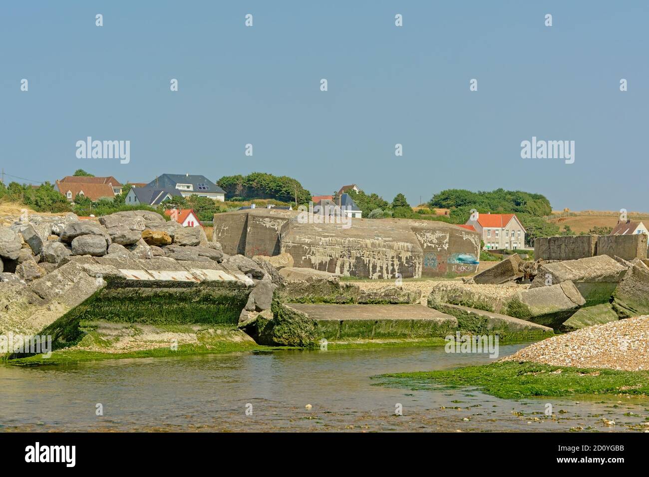 Ruins of of concrete world war two bunkers along river Slack mouth in ...