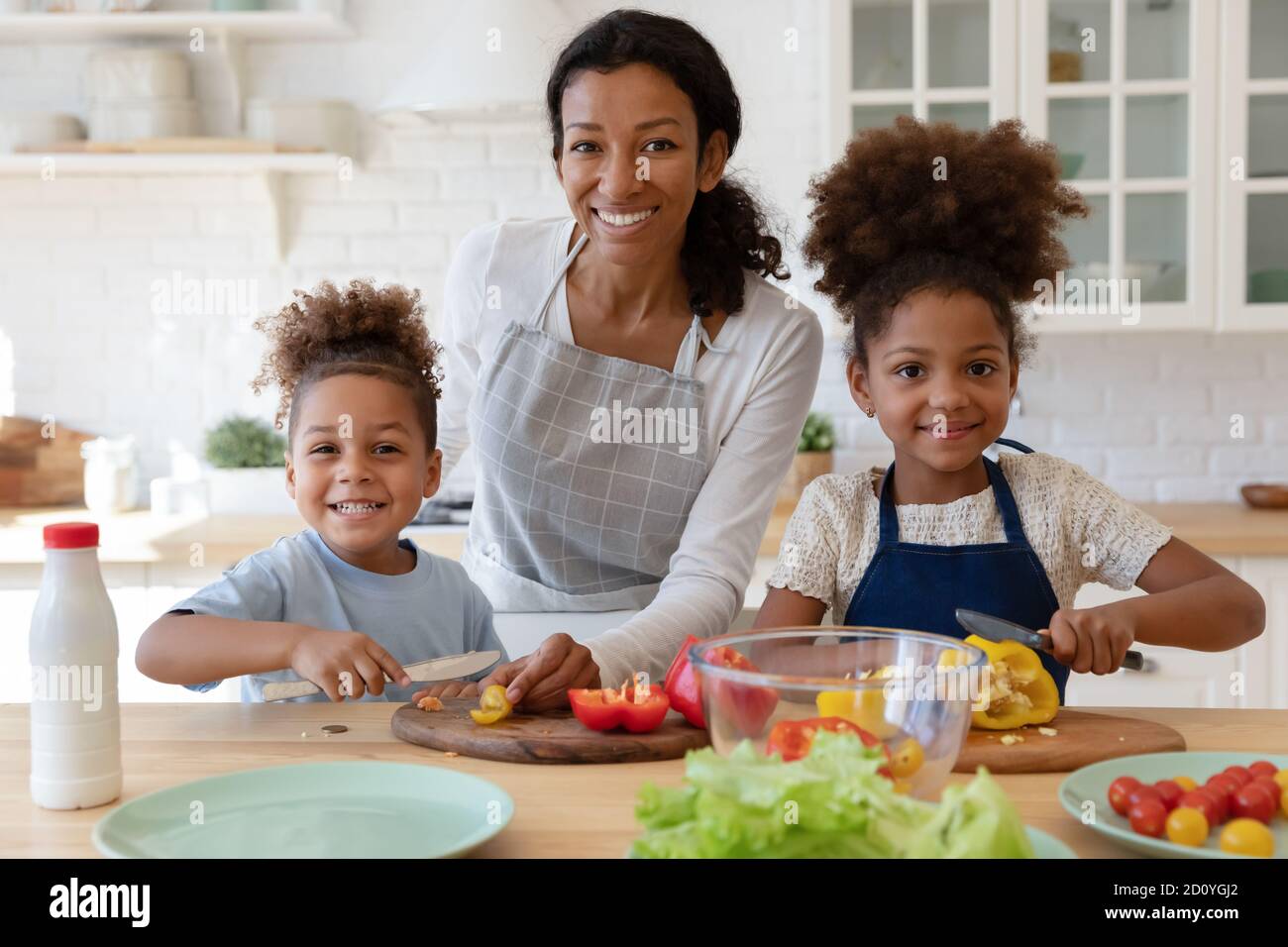 Portrait of happy african family cooking in kitchen Stock Photo - Alamy