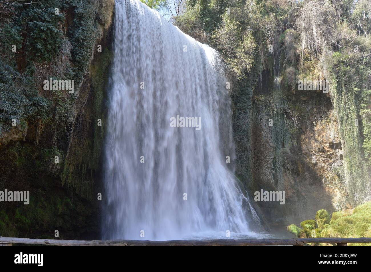Beautiful low waterfall in a forest at daytime Stock Photo - Alamy