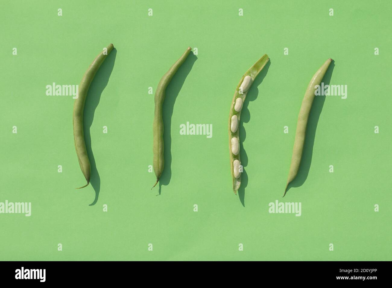 Top view of beans in their beanbag on a green background Stock Photo ...