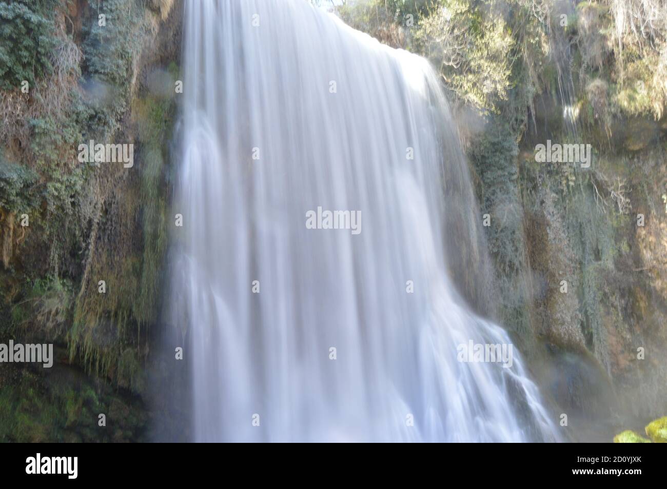 Beautiful low waterfall in a forest at daytime Stock Photo - Alamy