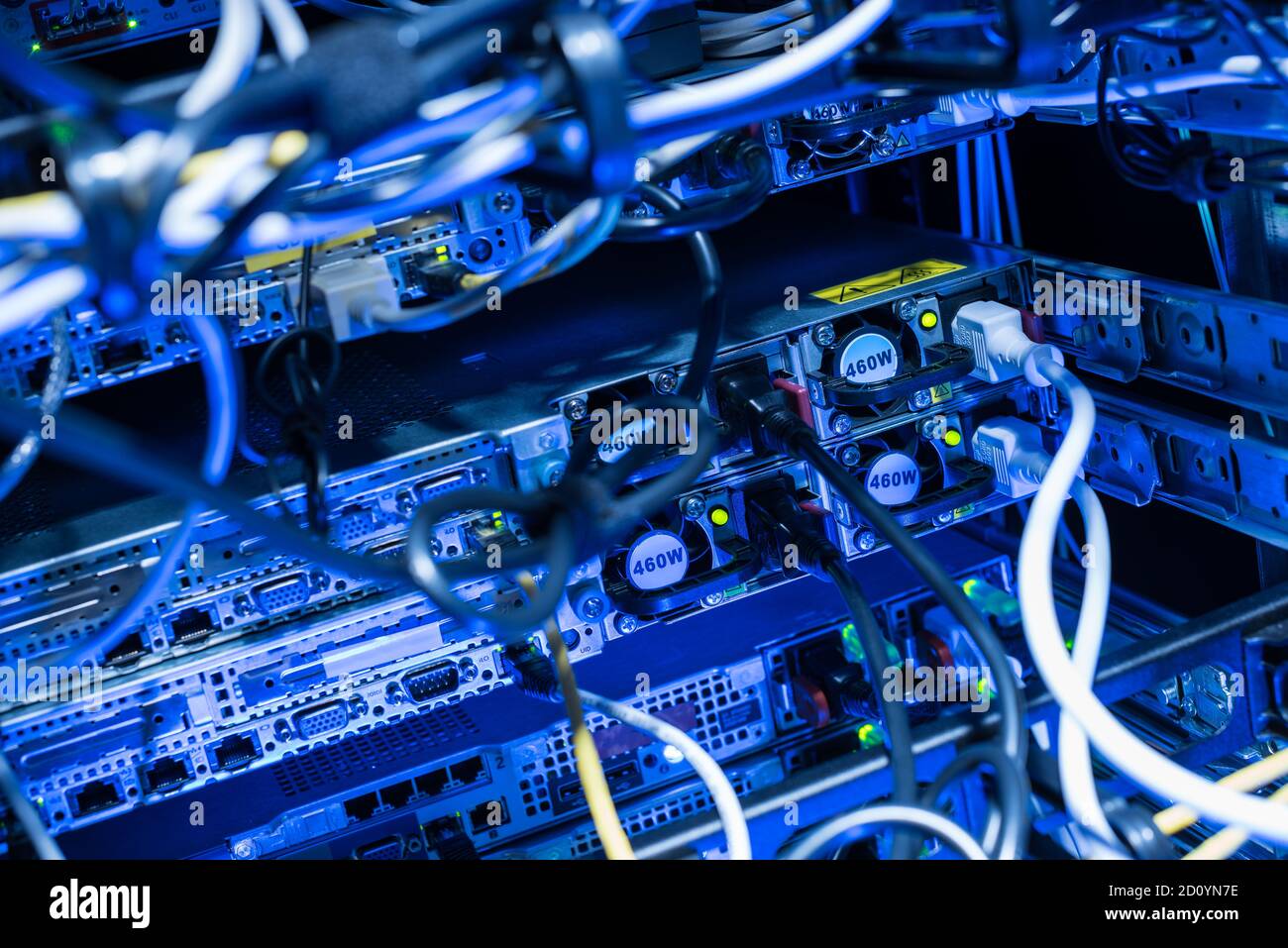 Backside of web servers in datacenter showing power connection cables ...