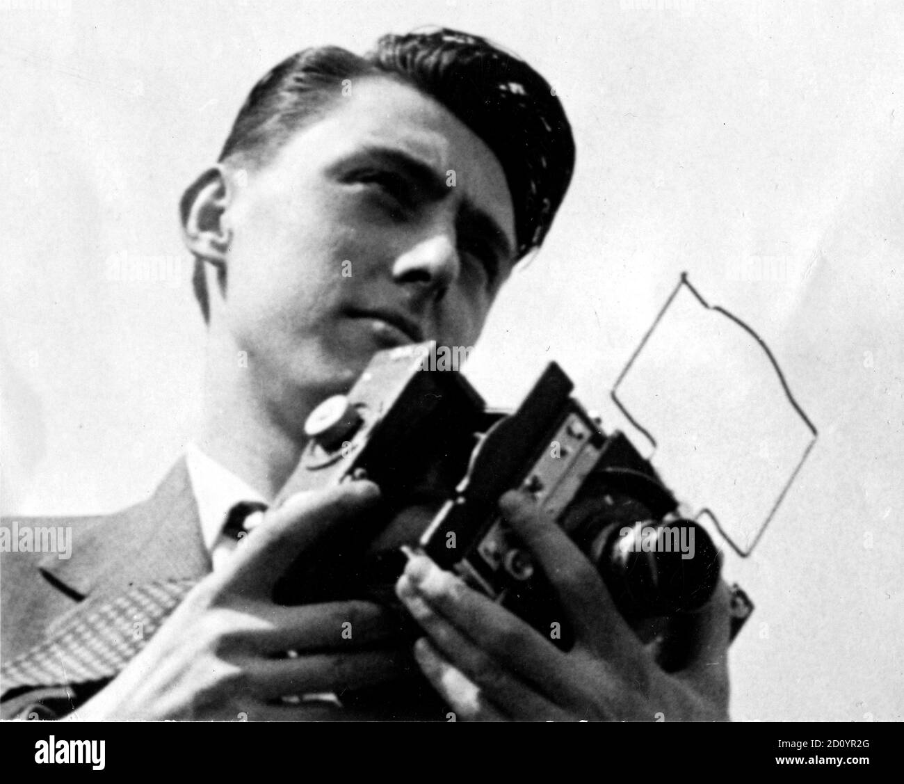 A young press-photographer of the 1950s with a VN Press Camera Stock ...