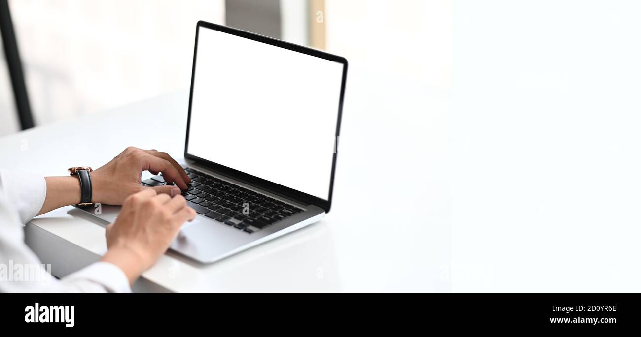 Copy space of man hand typing keyboard with office table background ...