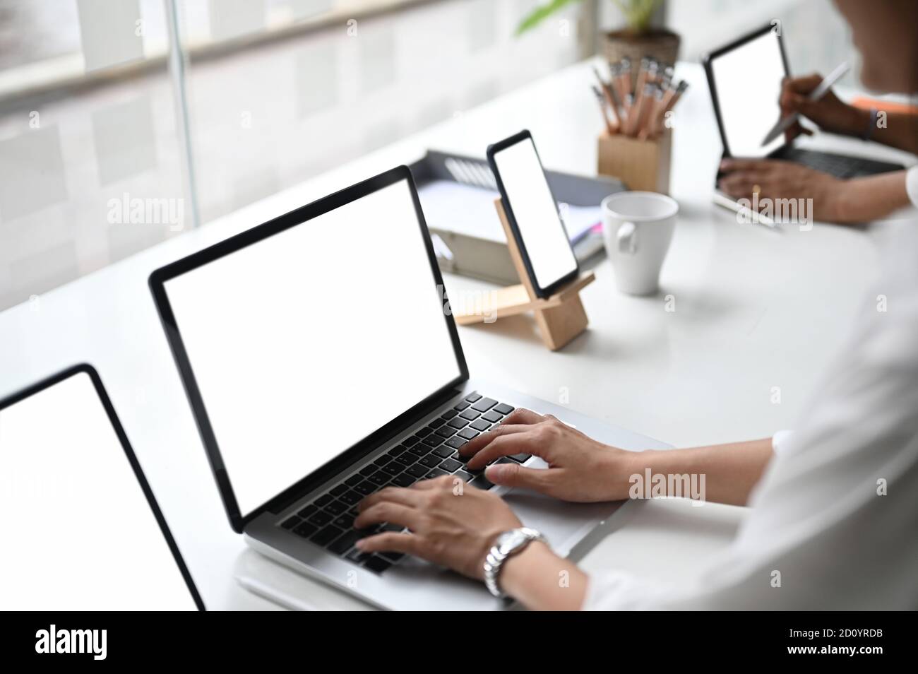 Ux Ui design, Development working on laptop with empty screen gadget ...