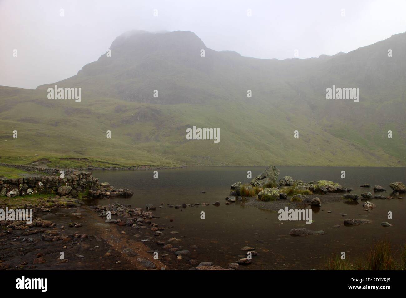 Stickle Tarn in pouring rain, Langdale Pikes, Lake District Stock Photo ...