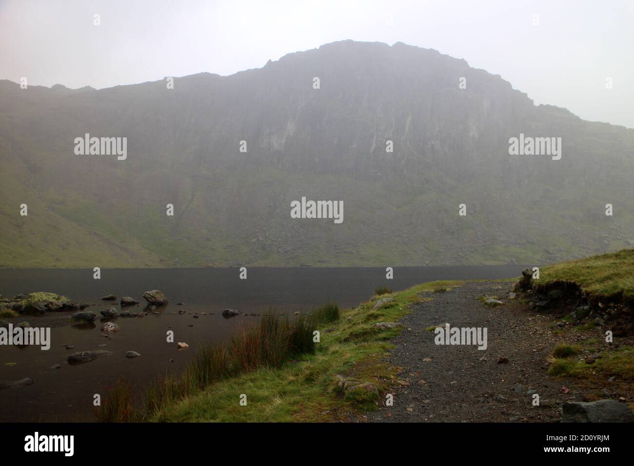 Stickle Tarn in pouring rain, Langdale Pikes, Lake District Stock Photo ...
