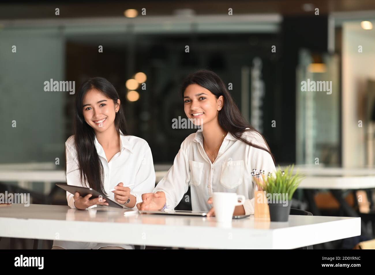 The designer team is working together with a computer tablet at the ...