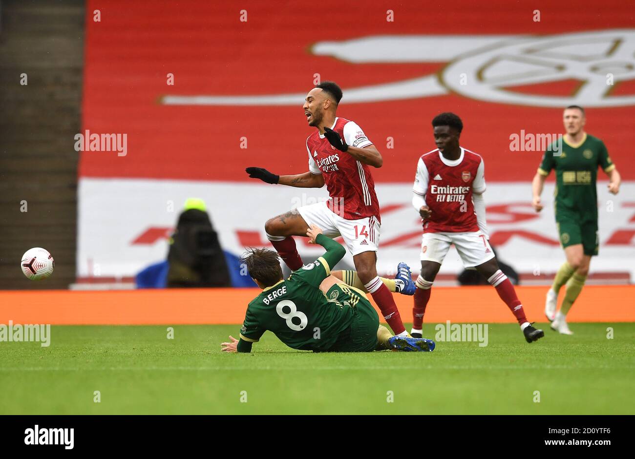 Sheffield United's Sander Berge (left) tackles Arsenal's Pierre-Emerick ...