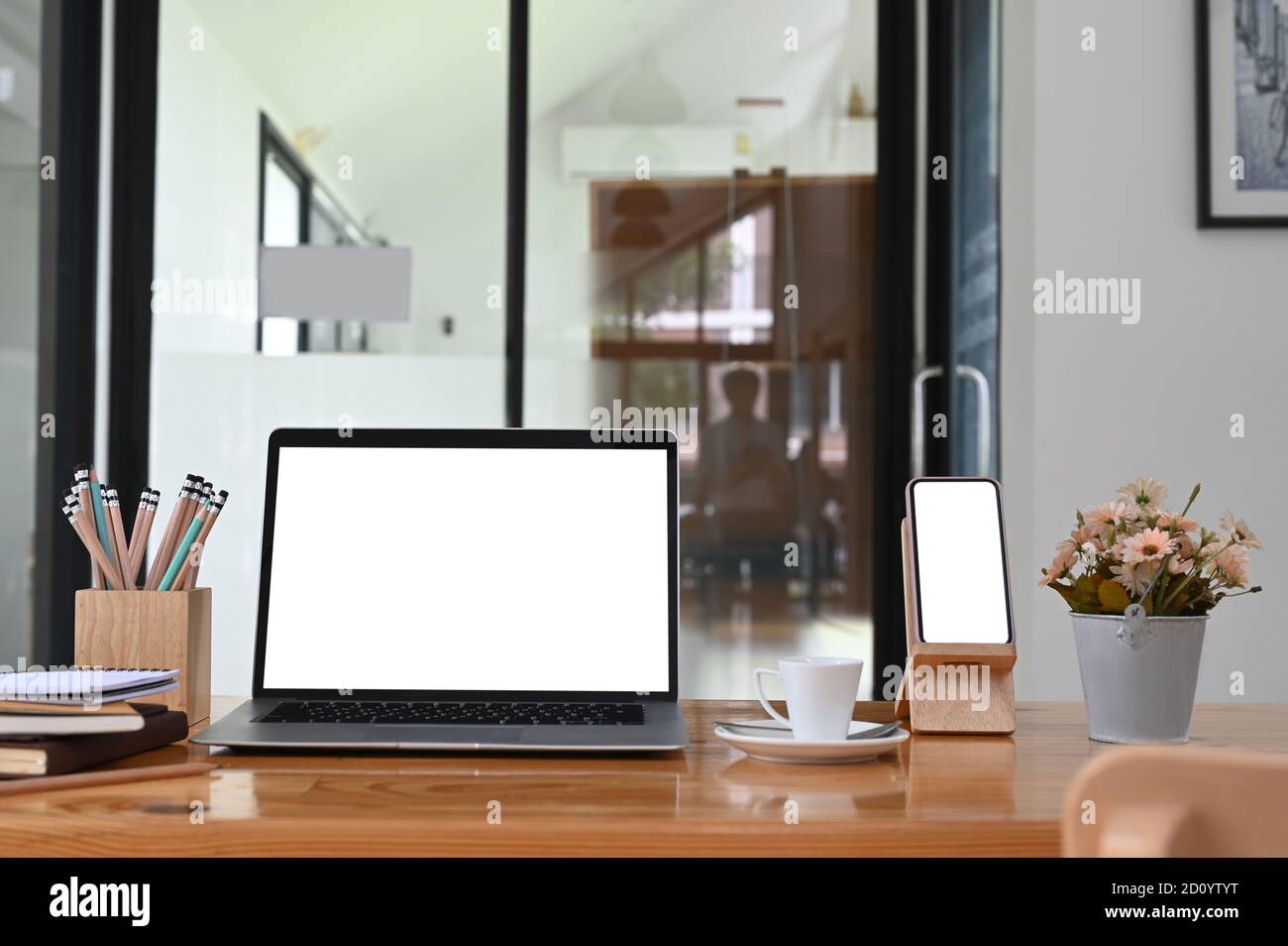 Office desk with laptop, smartphone white isolated screen and office ...