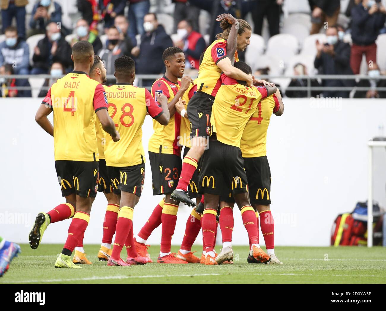 Yannick Cahuzac of Lens and teammates celebrate a goal during the ...
