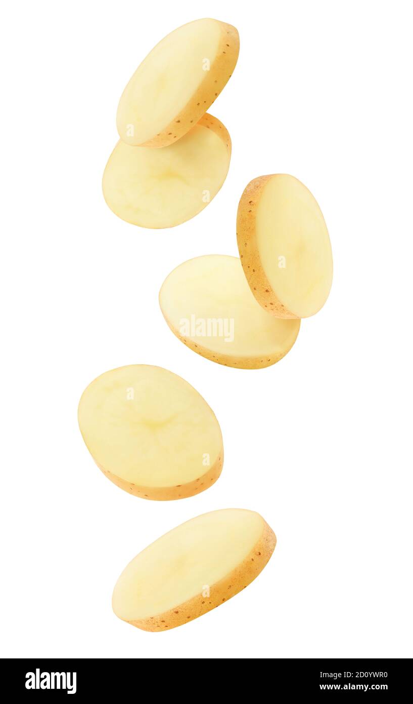 Isolated potato pieces in the air. Unpeeled slices of raw washed potato ...