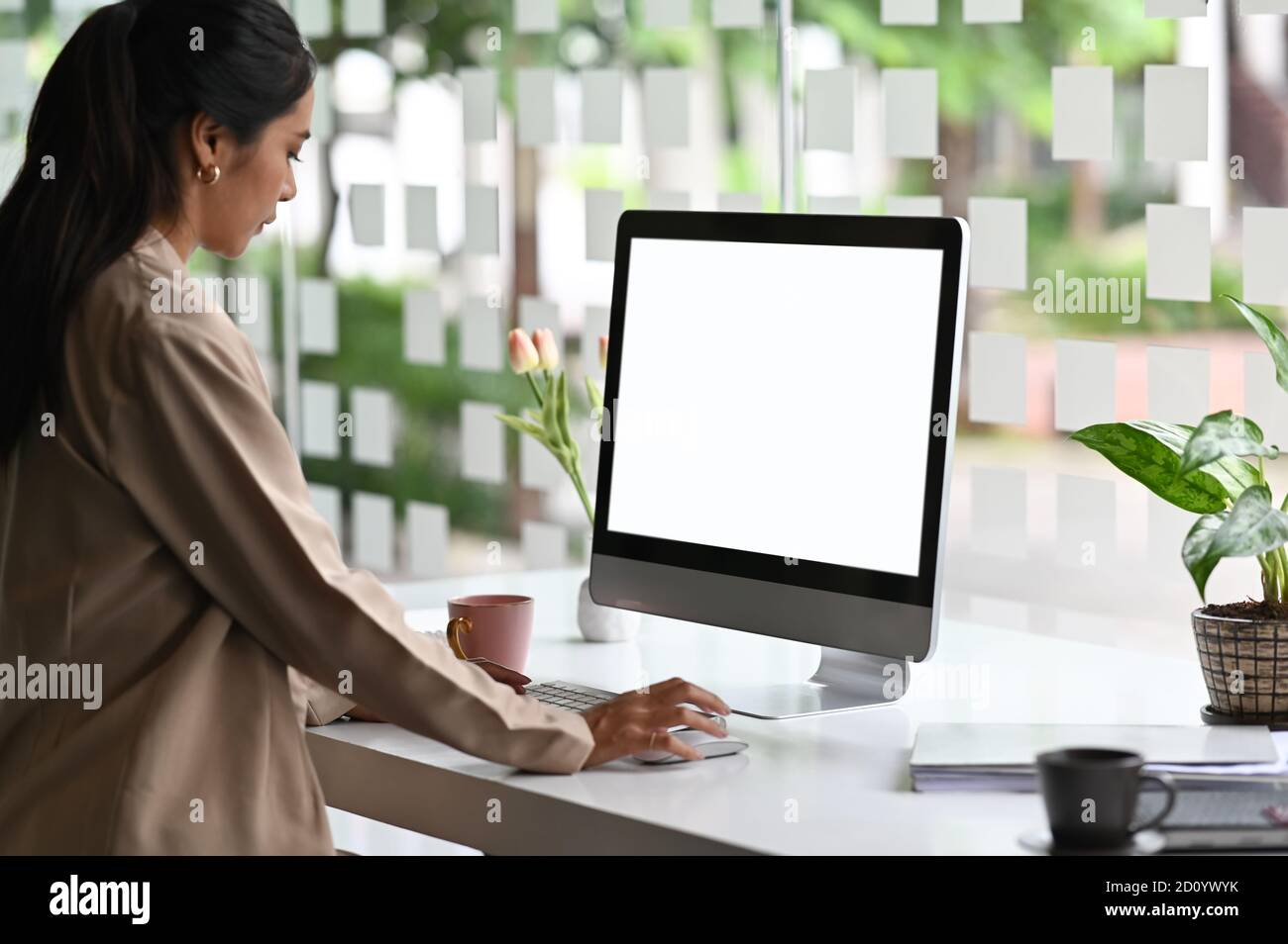 Beautiful woman designer editing her project with computer pc with ...