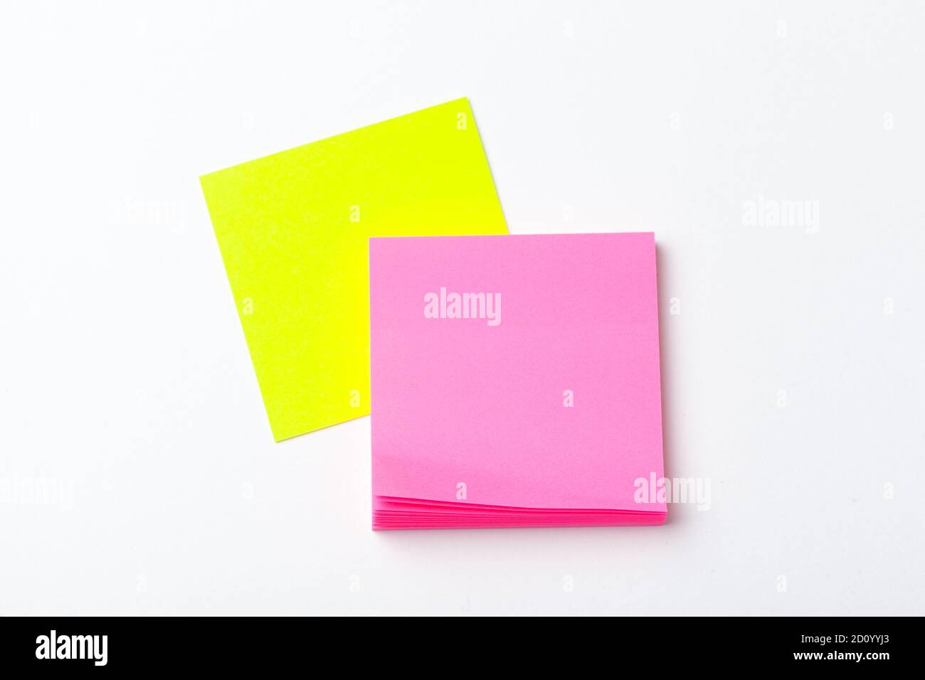 Sticky notes of bright colors close up on paper background. School or ...