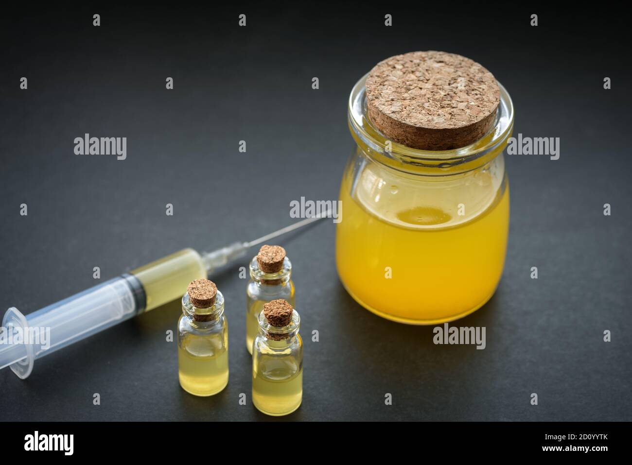 Orange colored liquid in a bottle. Concept Stock Photo - Alamy