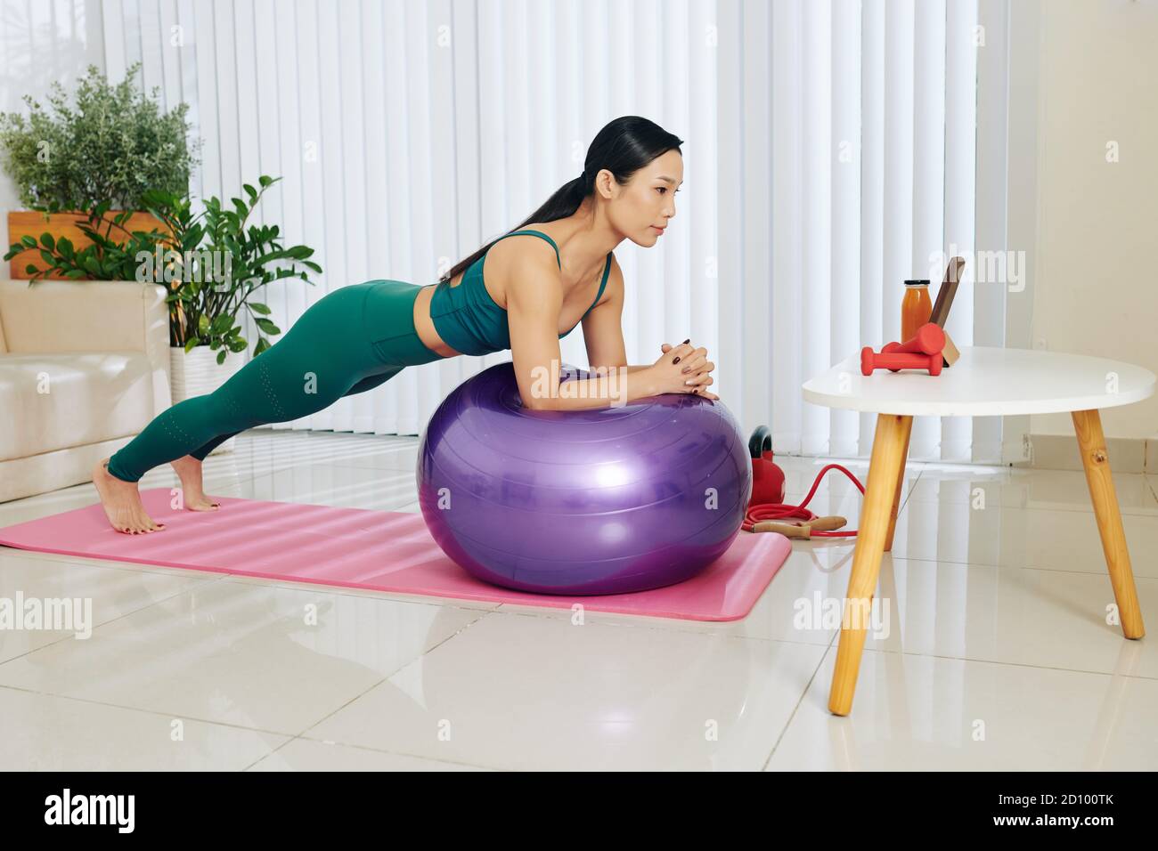 Balancing on fitness ball Stock Photo - Alamy