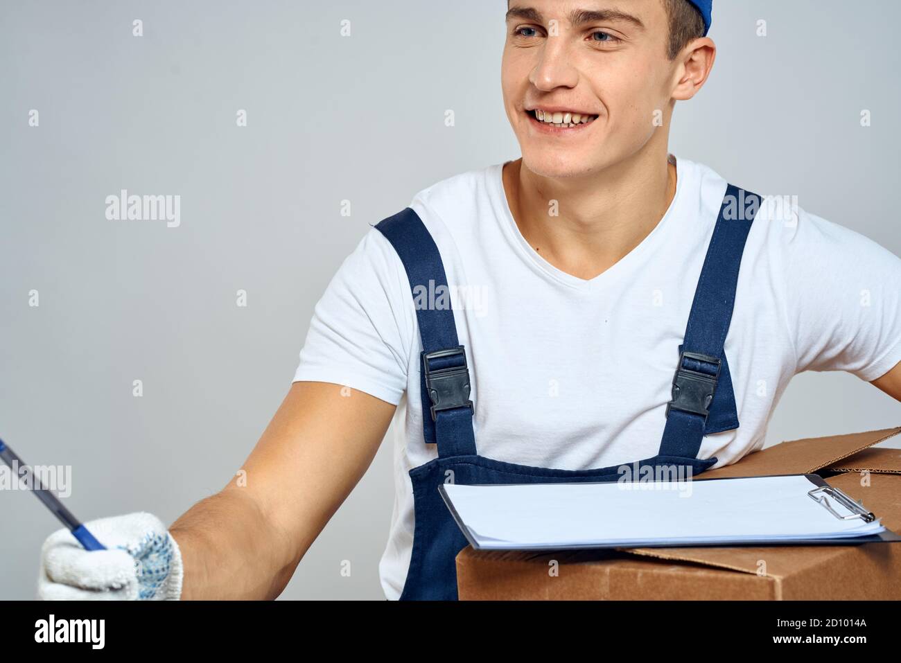 Man worker with box in hands delivery loading service packing service ...