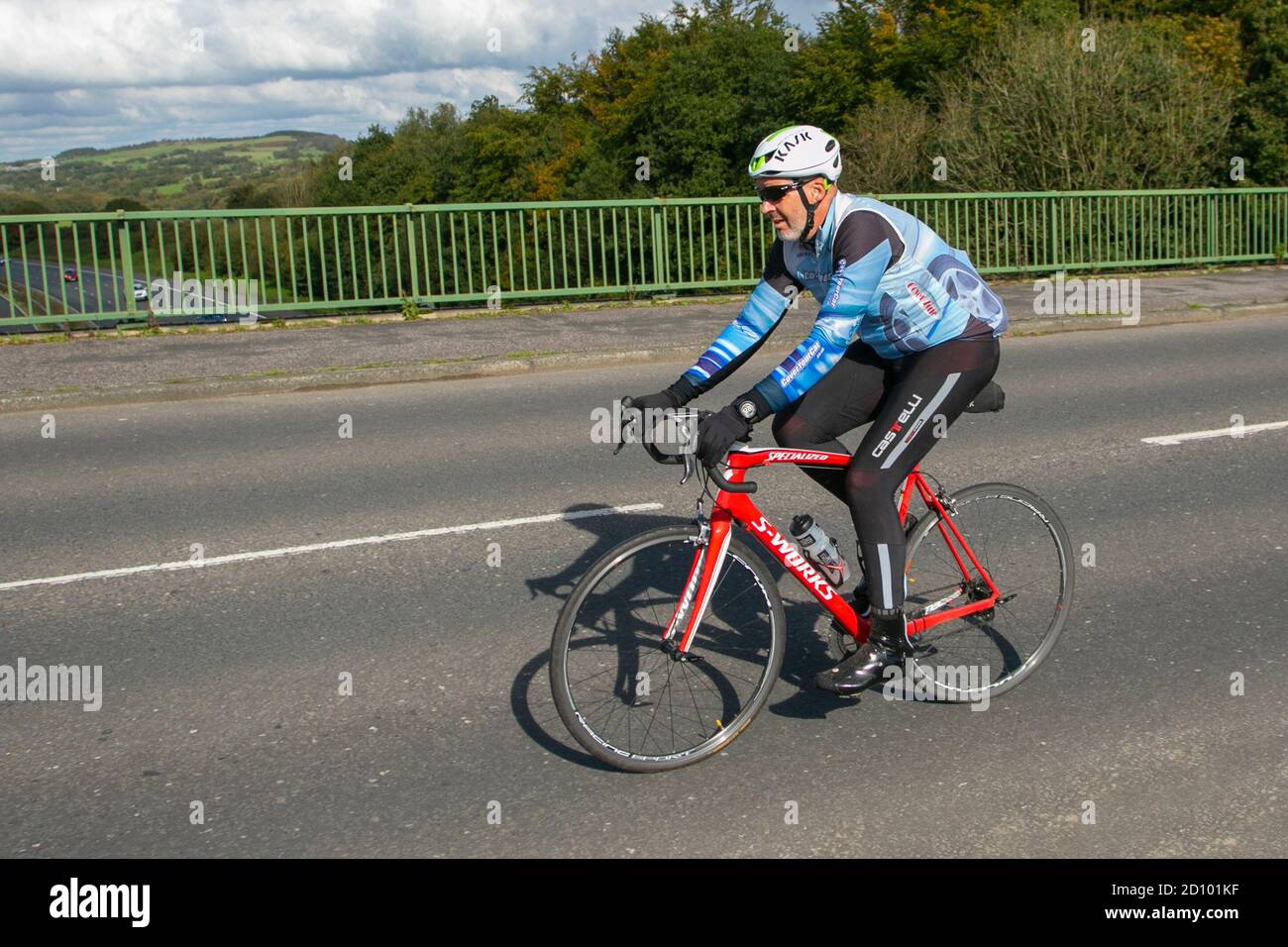 Male cyclist riding Specialzed S-works sports road bike on countryside ...