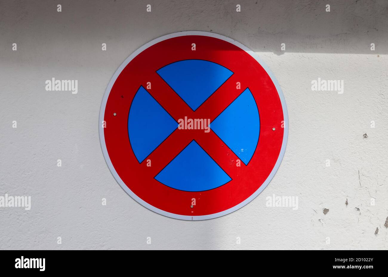 Closeup of a stop prohibited traffic sign on a white wall Stock Photo ...