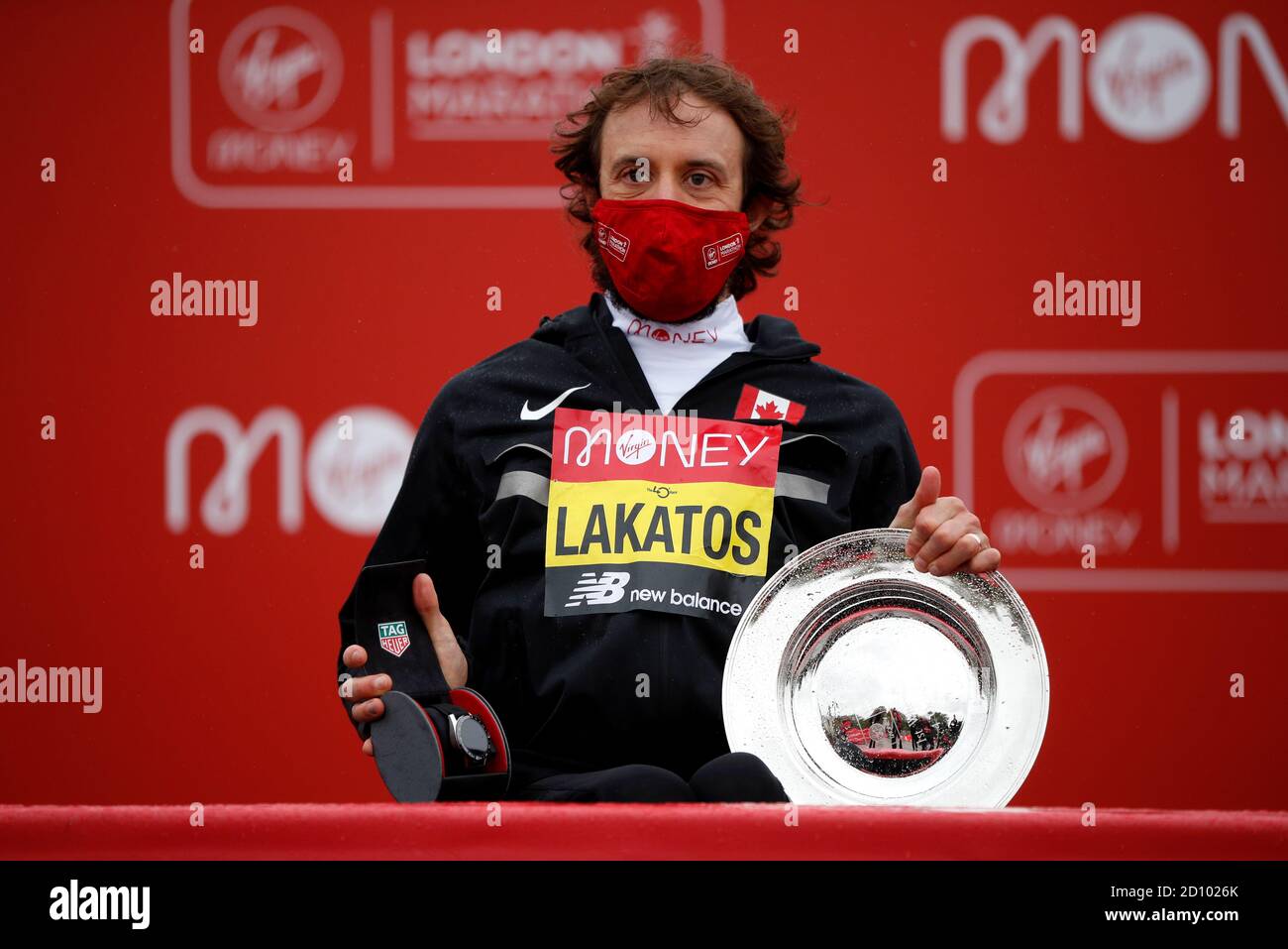 Canada's Brent Lakatos celebrates on the podium after winning the Elite ...