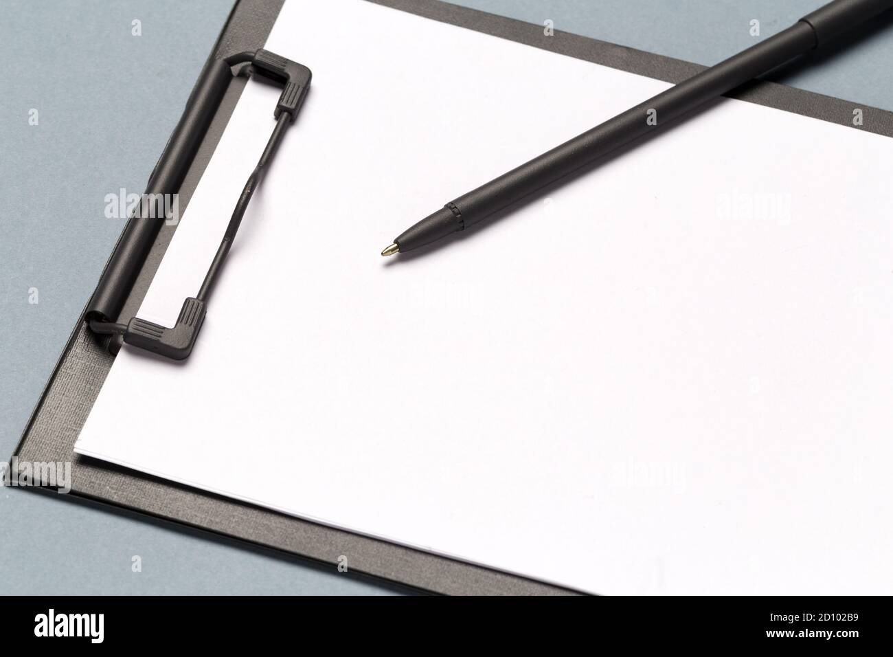 Notes clipboard with pen and blank sheets of paper as mock up copy ...