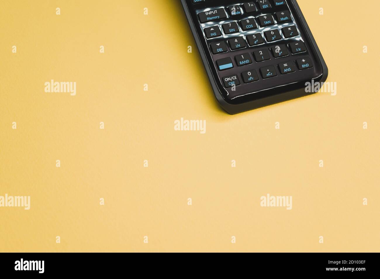 Scientific calculator on pastel yellow background with an empty space ...