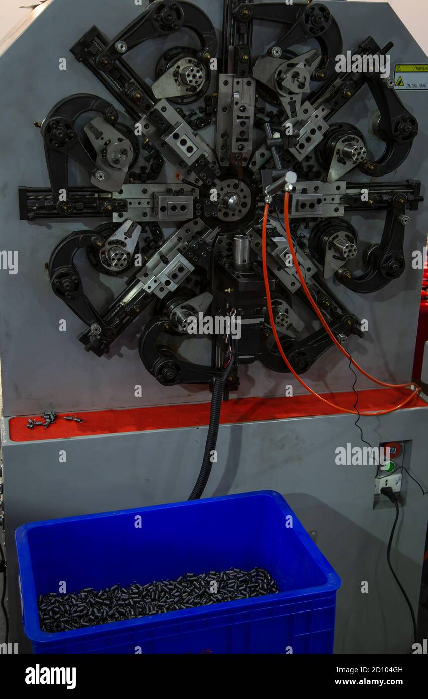 Automatic CNC spring coiling machine. Industrial machinery Stock Photo ...
