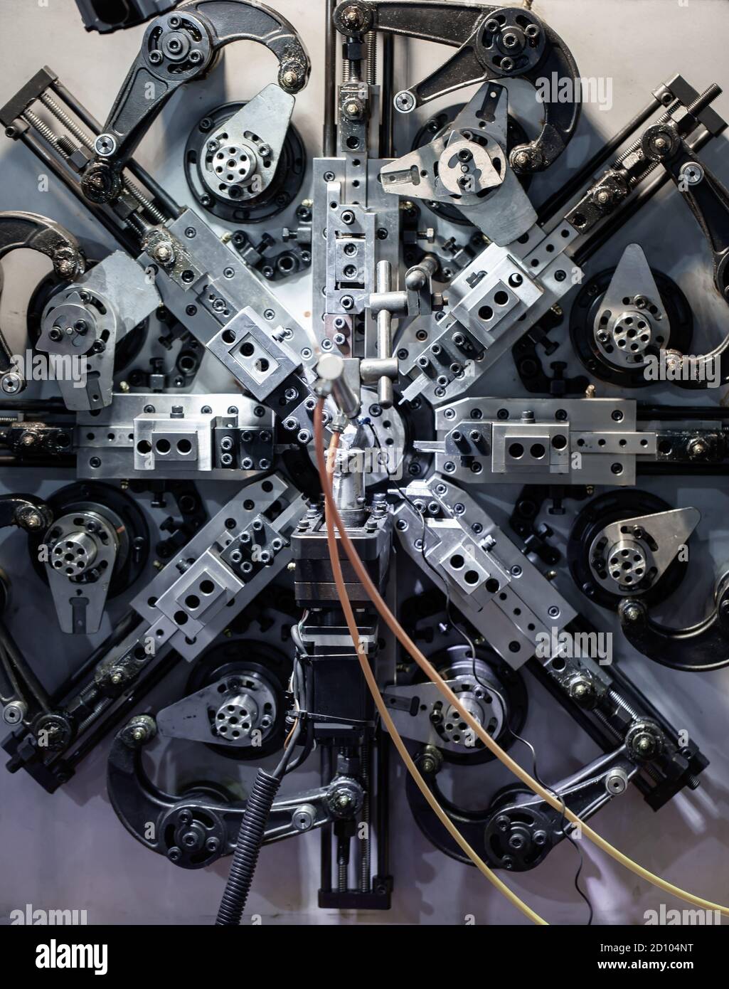 Automatic CNC spring coiling machine. Industrial machinery Stock Photo ...