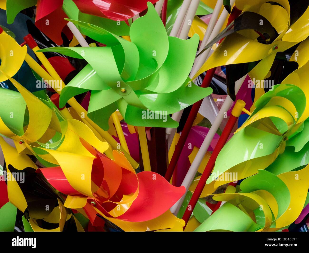 Rainbow colored pinwheels toys. Pinwheel background Stock Photo - Alamy