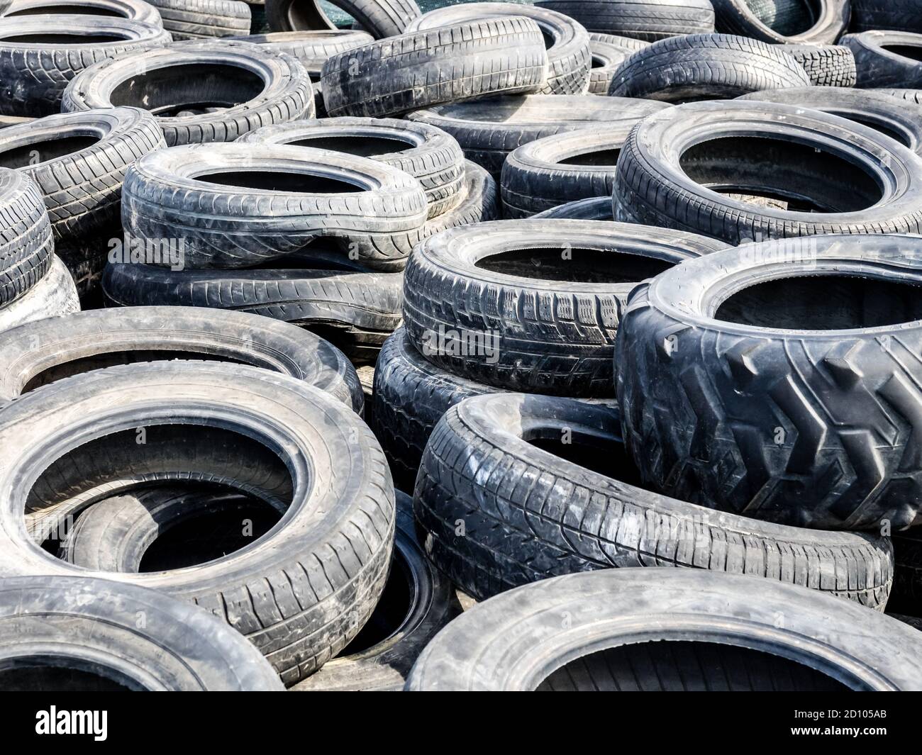Large pile of tires dump. Illegal garbage dump. The concept of ecology ...